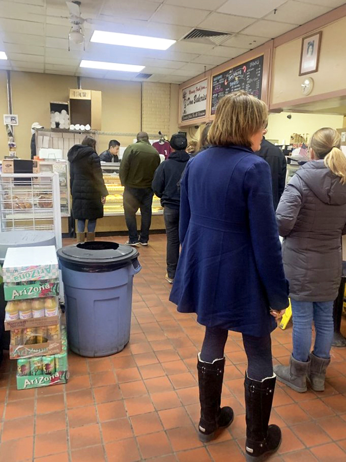 The line forms here for happiness. These patient patrons know that good things come to those who wait (for donuts).