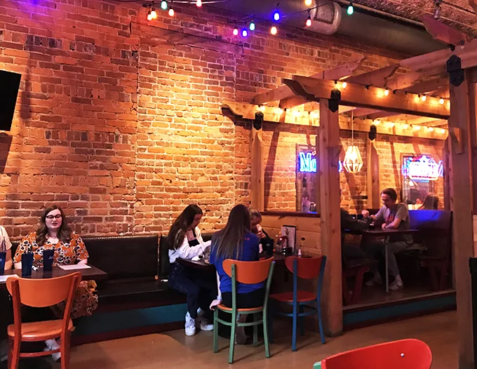 A gathering of food adventurers! These diners are embarking on a culinary journey that's part Wild West, part Tex-Mex wonderland.