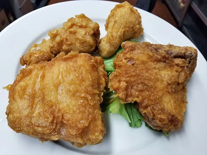 Fried chicken so golden and crispy, it could make Colonel Sanders hang up his apron in defeat. Finger-lickin' good doesn't even begin to cover it!