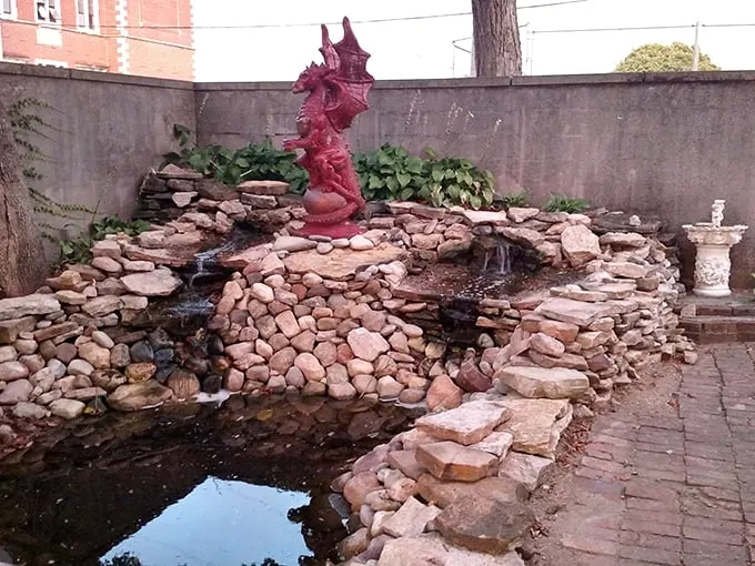 Who needs a moat when you've got this charming pond? Complete with dragon statue – perfect for keeping away pesky village invaders.