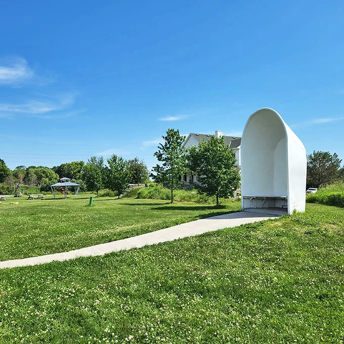 "Step into the art-side." This curved entrance invites visitors to leave the ordinary behind and enter a world of extraordinary creativity.