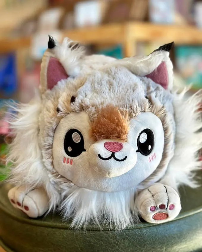 Cuddle up with a good book... and a cute critter! This adorable plush friend is ready to join you on your next literary adventure.