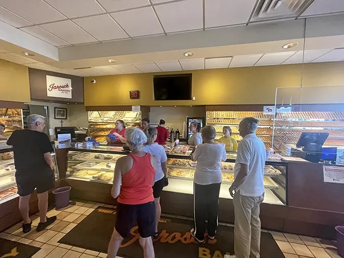 Behind the counter, where the magic happens. These baking wizards turn flour and sugar into pure bliss.