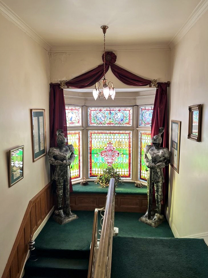 Guard your steps! These knightly sentinels flank a stunning stained-glass window. Talk about a grand entrance!