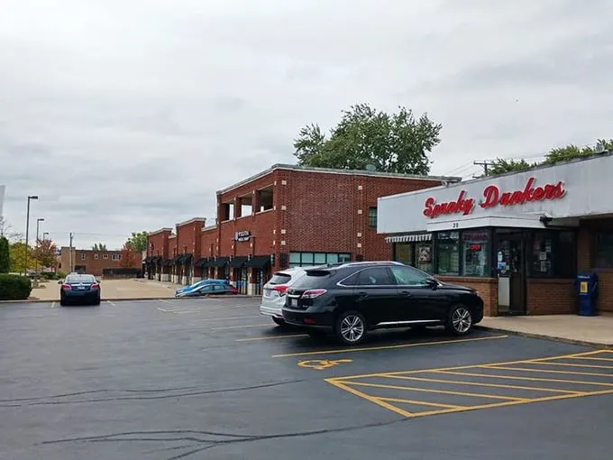 Park your appetite here! This unassuming lot is the gateway to a world of donut-fueled fantasies – your diet's kryptonite awaits within.