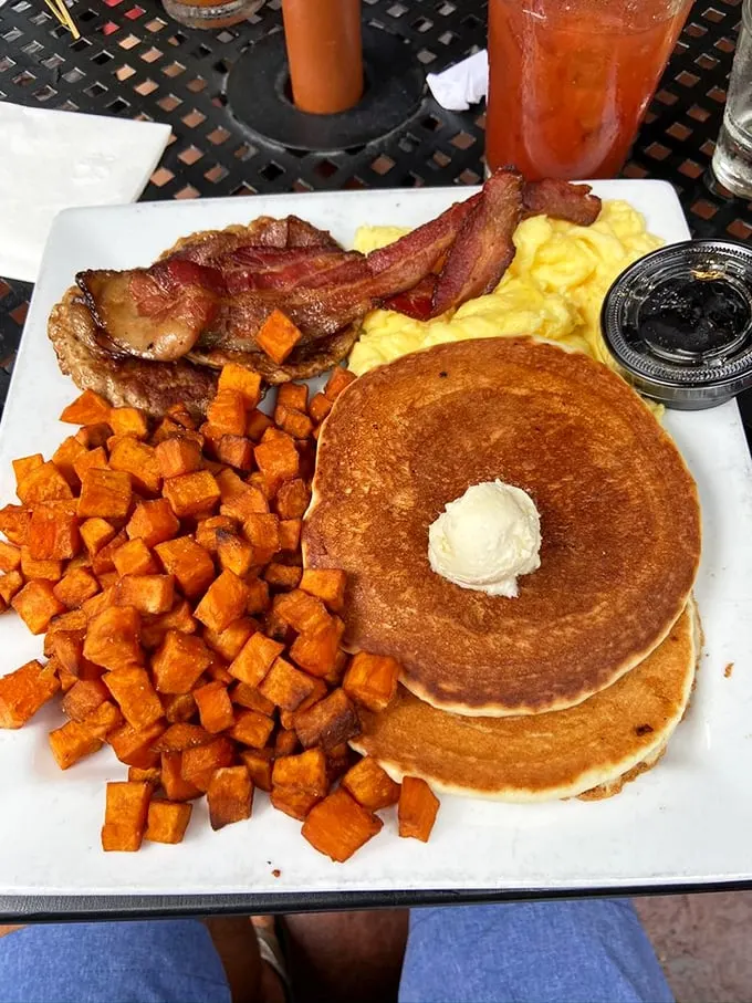 Rise and shine, it's flavor time! This breakfast spread is like a hug for your taste buds, complete with perfectly golden pancakes and home fries.