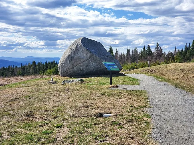 Nature's balancing act! This colossal boulder perches precariously, defying gravity and common sense.