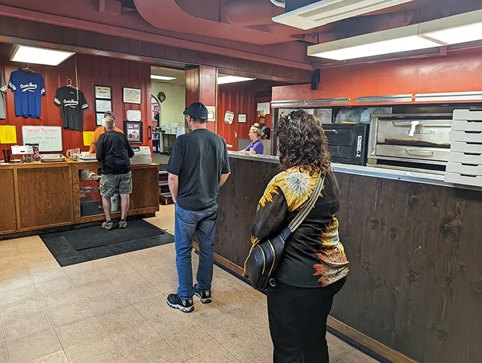 Step into a time capsule of flavor! This no-frills interior whispers tales of countless pizza pilgrimages and family gatherings.