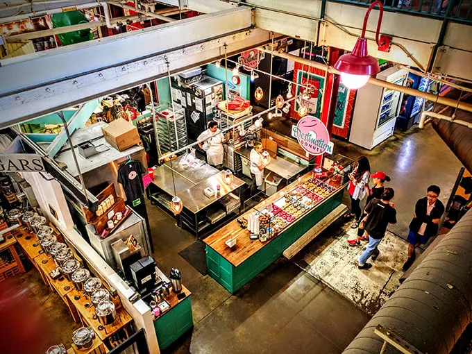 Donut-making magic unfolds before your eyes! This bustling kitchen scene is like Willy Wonka's factory for grown-ups, minus the Oompa Loompas but with extra sprinkles.