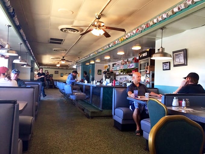 Step inside and feel the nostalgia wash over you. It's like walking onto the set of "Happy Days," but with better coffee and free Wi-Fi.