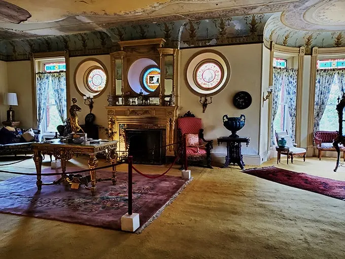 Step into a room that's part "Downton Abbey," part curiosity shop. Those circular windows are like portholes to another era – no seasickness required!