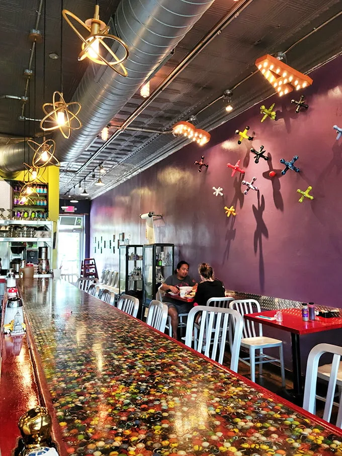 Atomic age meets diner chic! The Fly Trap's interior is a retro-futuristic feast for the eyes, with a dash of whimsy on the side.