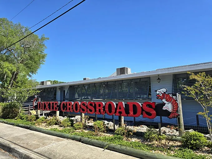 Welcome to seafood paradise! Dixie Crossroads' sign promises a crustacean celebration that'll make your taste buds do the cha-cha.