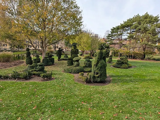 Green sculptures come alive! It's like Edward Scissorhands went on a artistic rampage – in the best way possible.