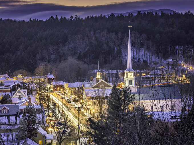 A scene straight out of a snow globe. Stowe's church steeple pierces a sky full of holiday magic.