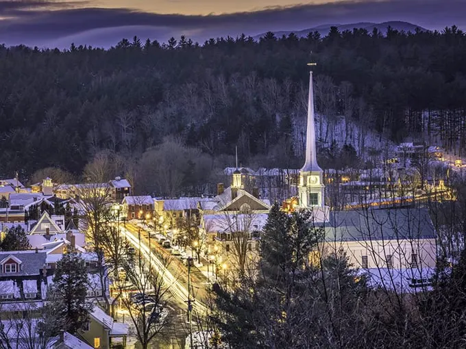 A scene straight out of a snow globe. Stowe's church steeple pierces a sky full of holiday magic.