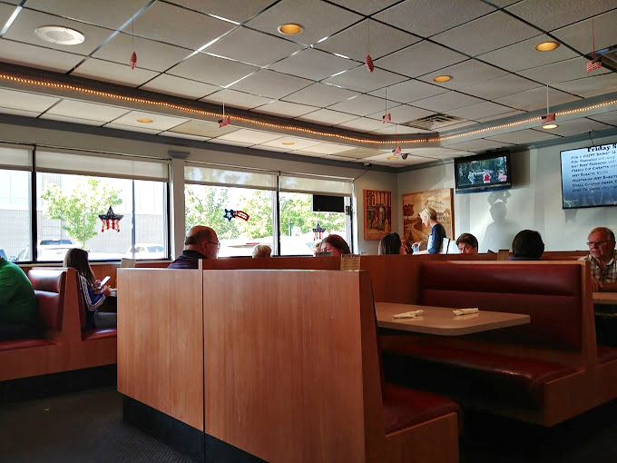 Cozy booths and warm lighting set the stage for memorable meals. It's like Cheers, but with better pancakes!