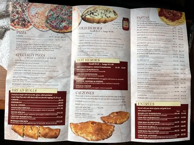 "Decision time, folks!" Mimmo's menu is a treasure map of Italian delights, from classic pizzas to pasta that would make nonna proud.