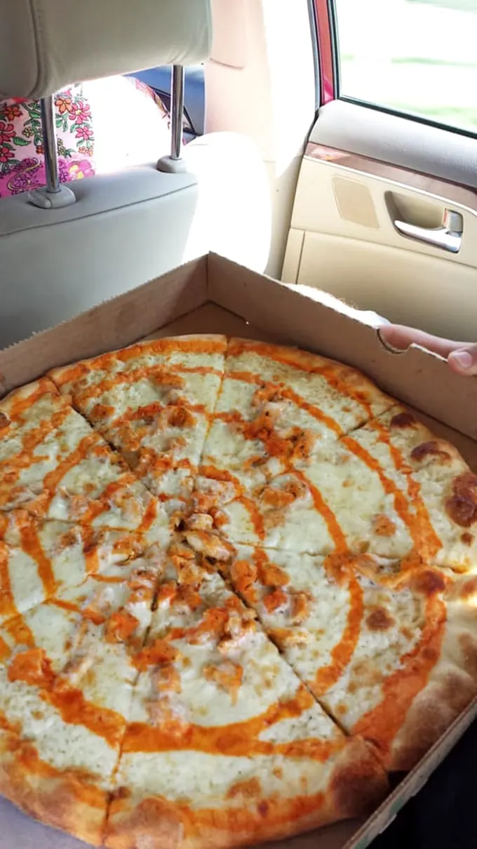 "Road trip fuel, Italian style." This pizza's swirls of sauce and toppings are like a delicious work of abstract art, perfect for devouring on the go.