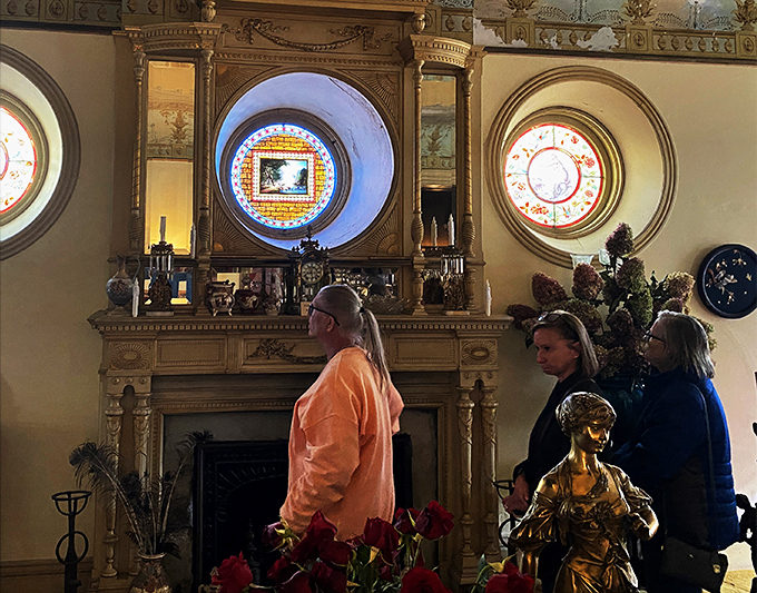 "And here we have the 'ooh' and 'aah' room." Visitors marvel at the ornate fireplace – it's like a museum piece you can actually warm your hands by!