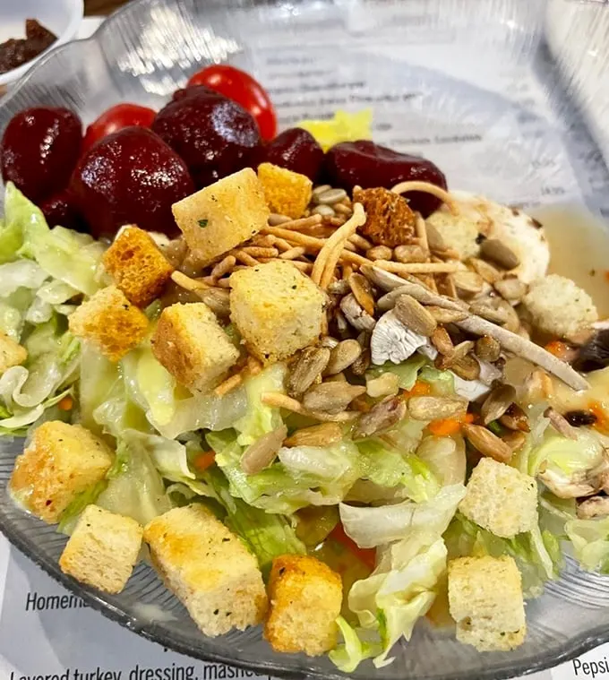 Salad: the opening act before the main event. But with those crunchy croutons and juicy grapes, this starter deserves its own standing ovation.