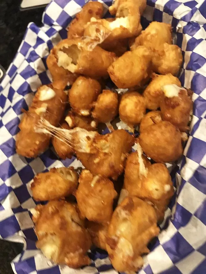 Great balls of flavor! These cheese curds are so golden and crispy, they'd make King Midas jealous.