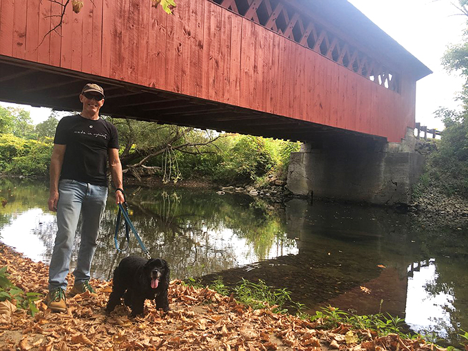 Man's best friend leads the way to adventure. This bridge isn't just crossing water—it's spanning generations of tail-wagging explorers.