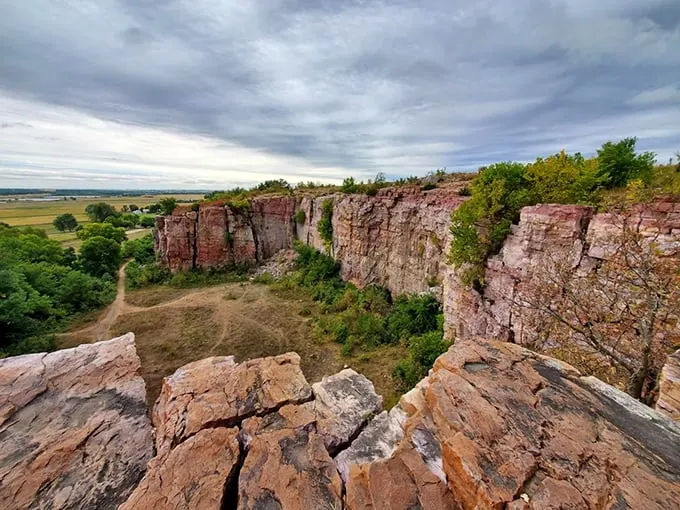 Blue Mounds State Park: Where the prairie meets the sky in a clash of pink quartzite. It's like the Grand Canyon's Midwestern cousin!