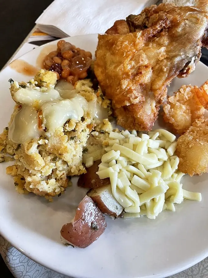 Fried chicken so golden, it belongs in Fort Knox! Paired with stuffing that's fluffier than a cloud, this plate is pure Midwest magic.