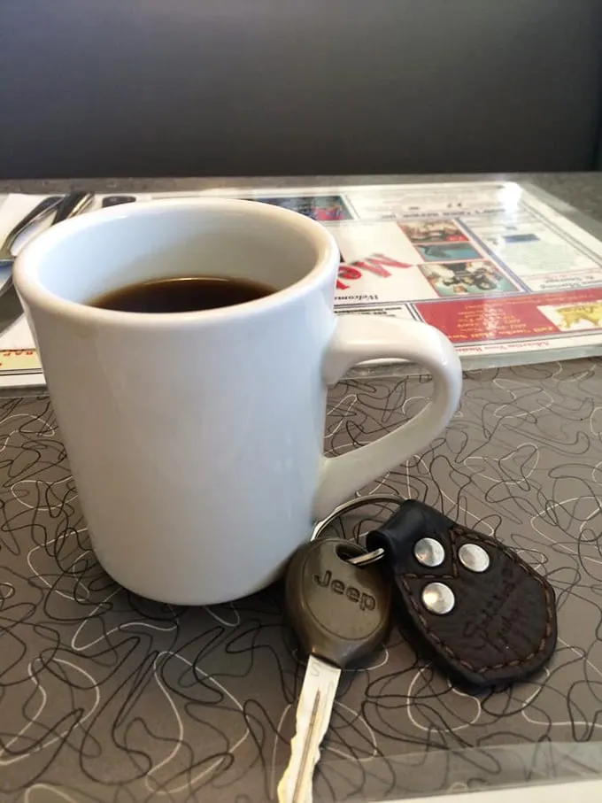 Coffee: The elixir of life, served in a mug that could double as a small swimming pool. Refills are free, naps are extra.