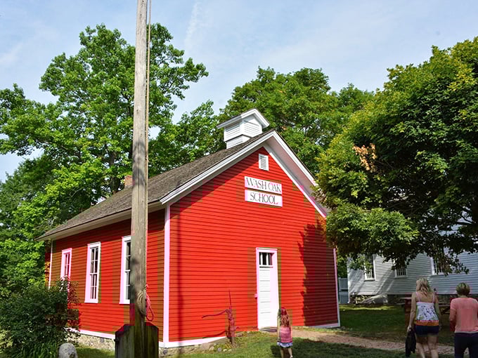 School's in session! This cherry-red schoolhouse is giving major "Little House on the Prairie" vibes. No iPads allowed – slate tablets only!