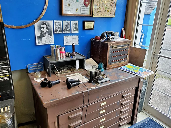 Behind the glass, these vintage phones rest like precious artifacts, each with its own story of
