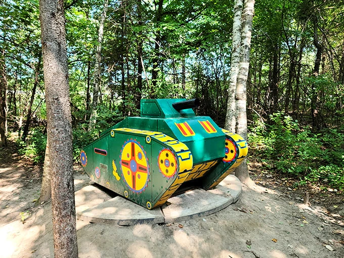 "When tanks trade firepower for flower power." This playful sculpture proves that even military vehicles can have a change of heart (and color).