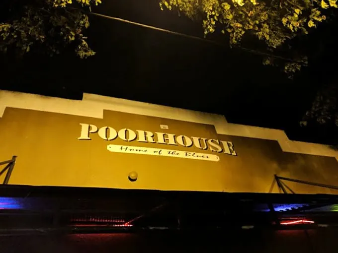 Graffiti, band posters, and alternative vibes. The Poorhouse interior is like a time capsule of cool that never went out of style.