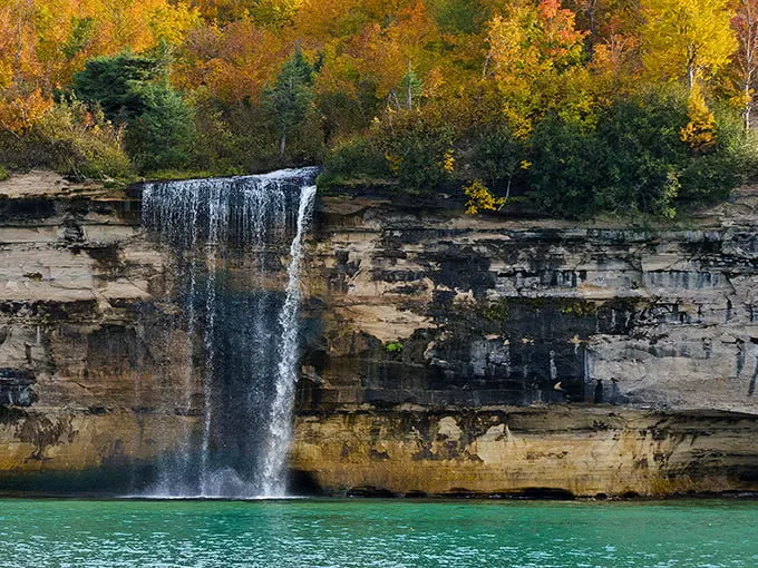 Nature's own IMAX: Spray Falls cascades down colorful sandstone cliffs, creating a spectacle that puts Hollywood special effects to shame.