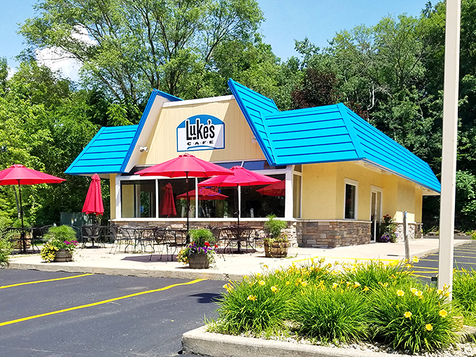 Welcome to breakfast paradise! Luke's Cafe's cheery exterior is like a ray of sunshine, promising delicious adventures within. Who needs a pot of gold when you've got a blue-roofed diner?