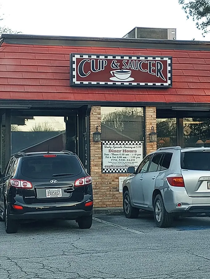 Welcome to Cup & Saucer, where the red roof promises comfort food that'll make your heart sing and your belt buckle beg for mercy.
