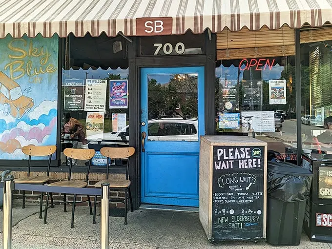 A brick facade with a whimsical mural? Sky Blue Cafe's exterior is like a warm hug for your eyeballs!
