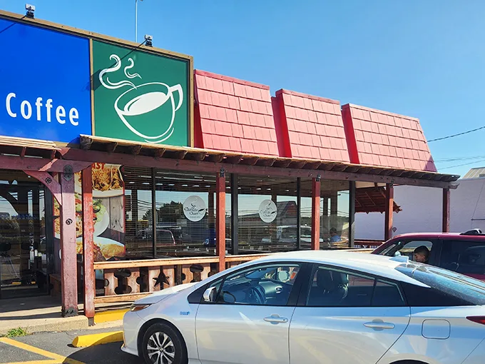 A beacon of breakfast hope! Dallas Diner's sign promises a haven for hungry souls, with a winking coffee cup that seems to say, "Come on in, sleepyhead!"