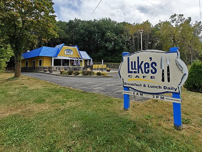Welcome to breakfast paradise! Luke's Cafe's cheery exterior is like a ray of sunshine, promising delicious adventures within. Who needs a pot of gold when you've got a blue-roofed diner?