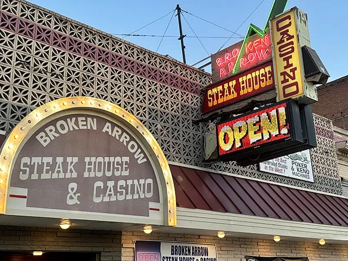 Neon dreams and sizzling steams! This vintage facade is like a beacon for hungry souls in the Montana night.