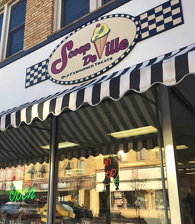 Step back in time! Scoop De Ville's charming storefront is like a portal to the 1950s, complete with a classic awning and neon signs.