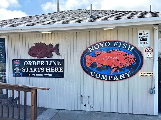 Welcome to seafood paradise! Noyo Fish Company's exterior promises a feast for the senses, with its charming weathered siding and eye-catching signage.
