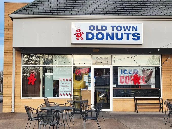 Welcome to donut paradise! Old Town Donuts beckons with its cheery red sign, promising sweet delights and a slice of small-town charm.
