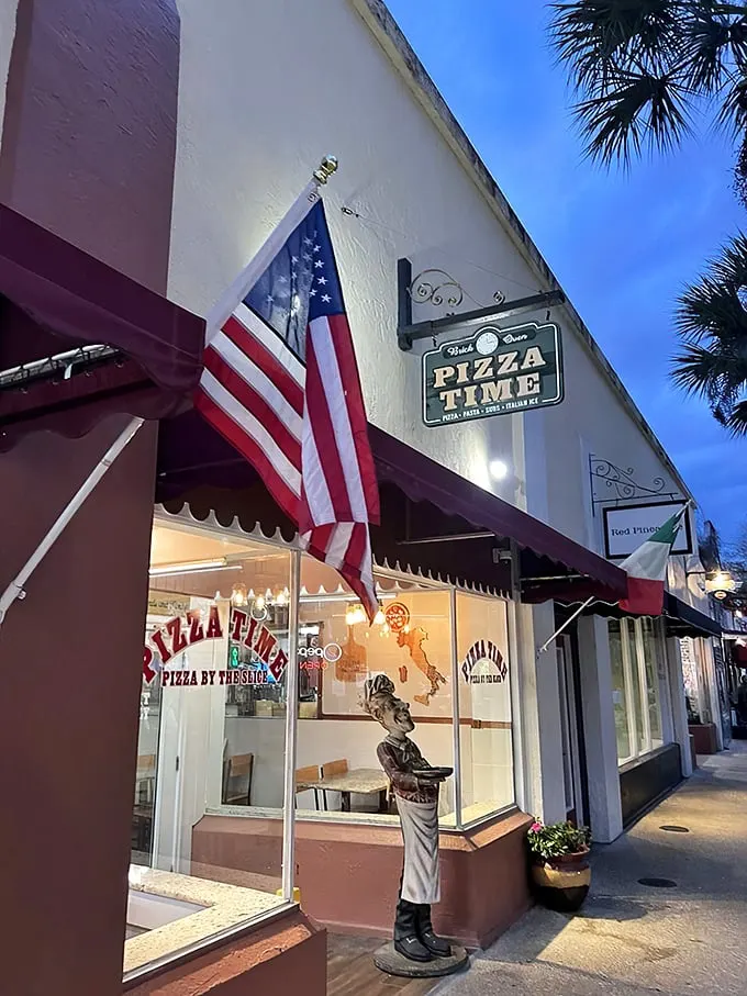 Welcome to pizza paradise! This unassuming storefront is like Clark Kent's phone booth – step inside for a super transformation of your taste buds.
