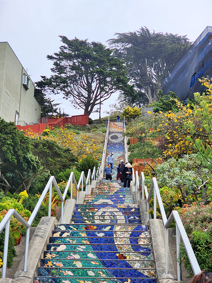 Step into a world of wonder! These mosaic-covered stairs are like a Willy Wonka fever dream, minus the chocolate river but with extra whimsy.