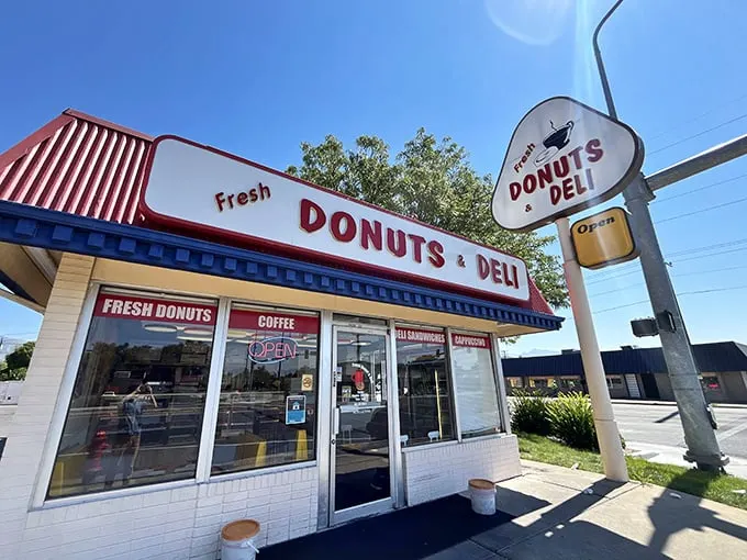 A donut oasis in the desert! This unassuming shop, with its cheery red roof and retro sign, promises sweet salvation for sugar-seekers.