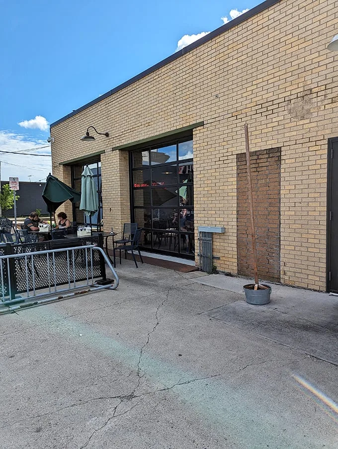 Brew Bird's curved brick exterior isn't just a wall—it's a warm hug welcoming you to flavor town. This unassuming facade hides a world of culinary delights waiting to be discovered.
