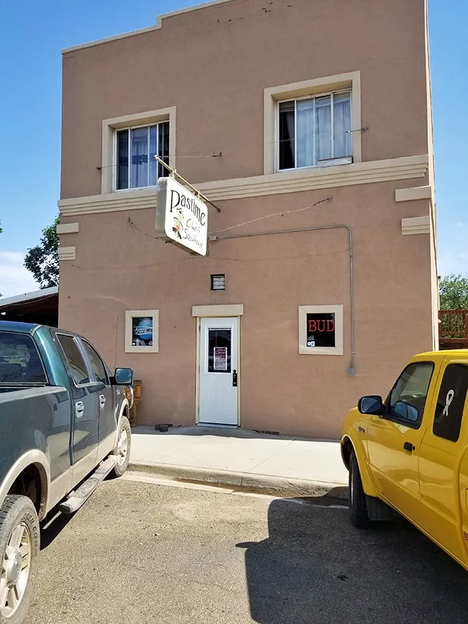 Welcome to flavor town! The Pastime Club & Steakhouse's unassuming exterior hides a world of culinary delights, proving you should never judge a book by its cover – or a steakhouse by its siding.