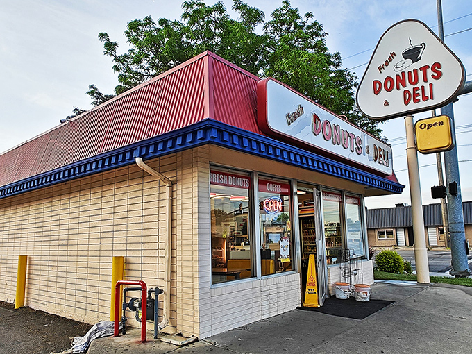 A donut oasis in the desert! This unassuming shop, with its cheery red roof and retro sign, promises sweet salvation for sugar-seekers.